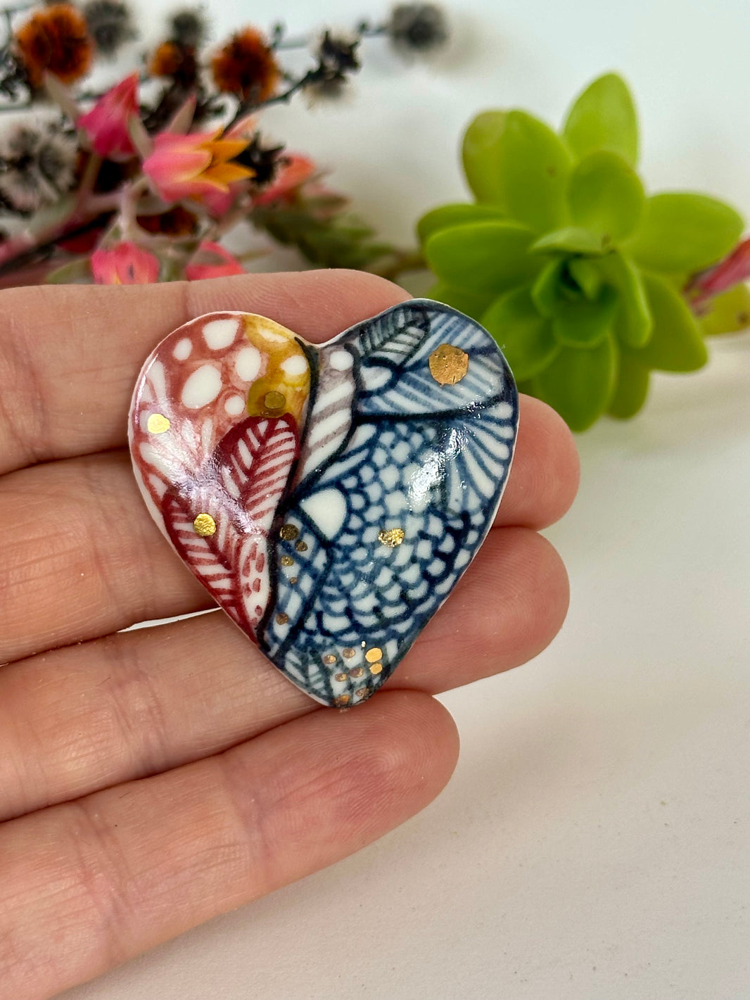 Brooches, coral and handpainted designs – Katherine Wheeler Ceramics